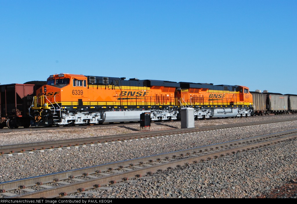 Brand new GEVO's as Helper units BNSF 6339 lead unit and BNSF 6337 with a automatic decouper ...